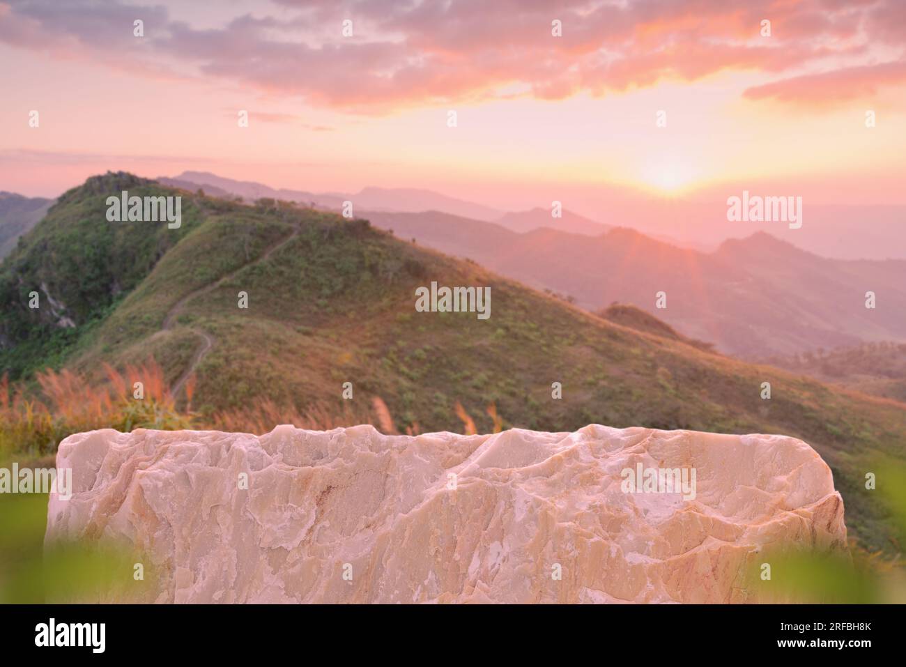 Stone podium outdoors on golden sky at sunset with mountain nature ...