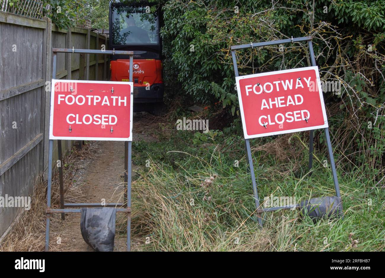 A red and white sign warning that a public footpath is closed for works ...