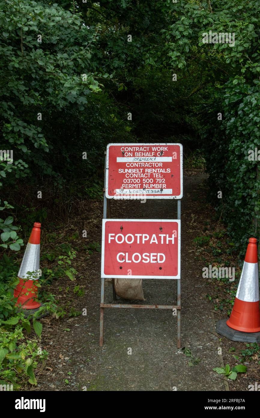 Red and white sign warning that a public footpath is closed for works ...