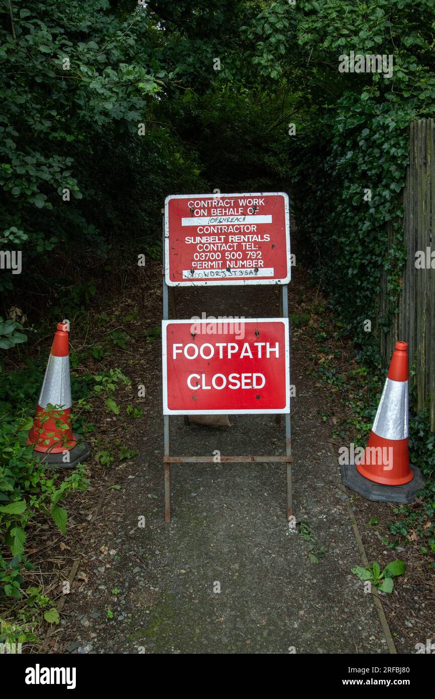 Red and white sign warning that a public footpath is closed for works ...