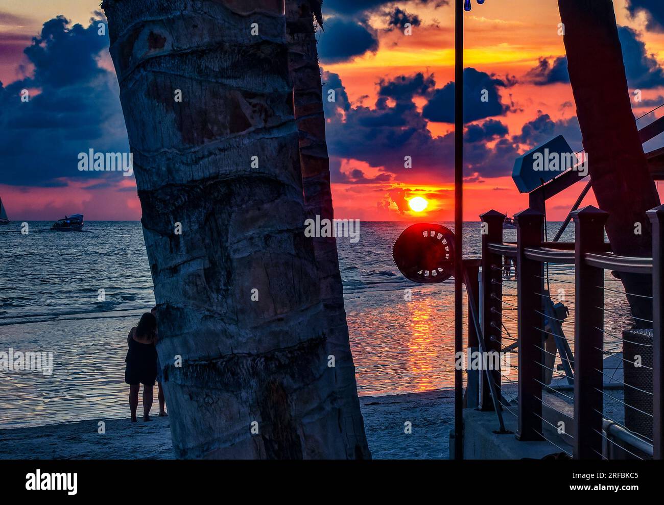 A sunset scene at a beach resort Stock Photo - Alamy