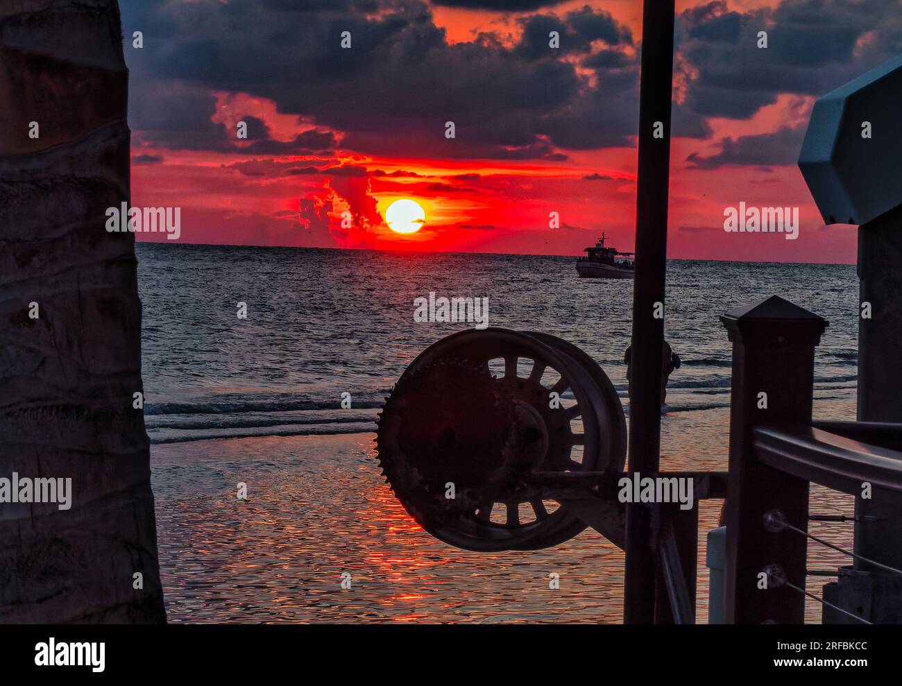 A sunset scene at a beach resort Stock Photo - Alamy