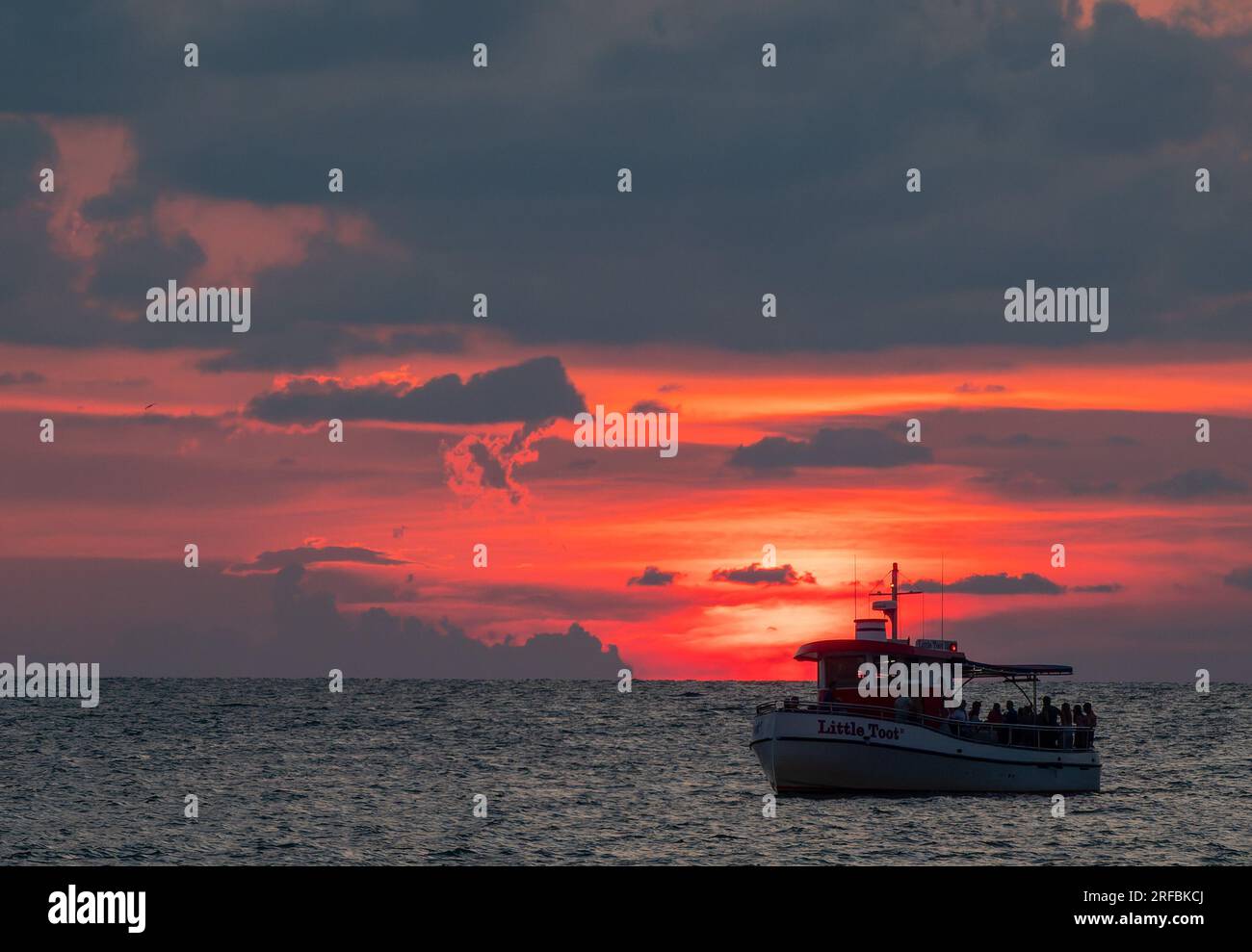 A sunset scene at a beach resort Stock Photo - Alamy