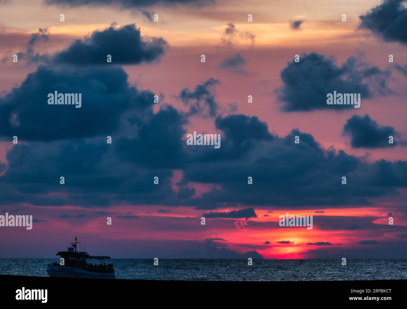 A sunset scene at a beach resort Stock Photo - Alamy