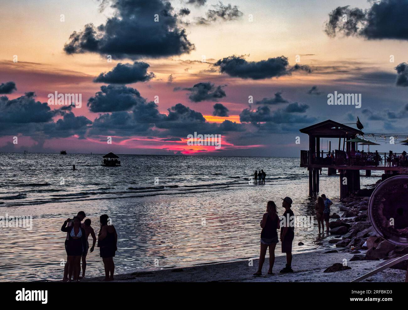 A sunset scene at a beach resort Stock Photo - Alamy