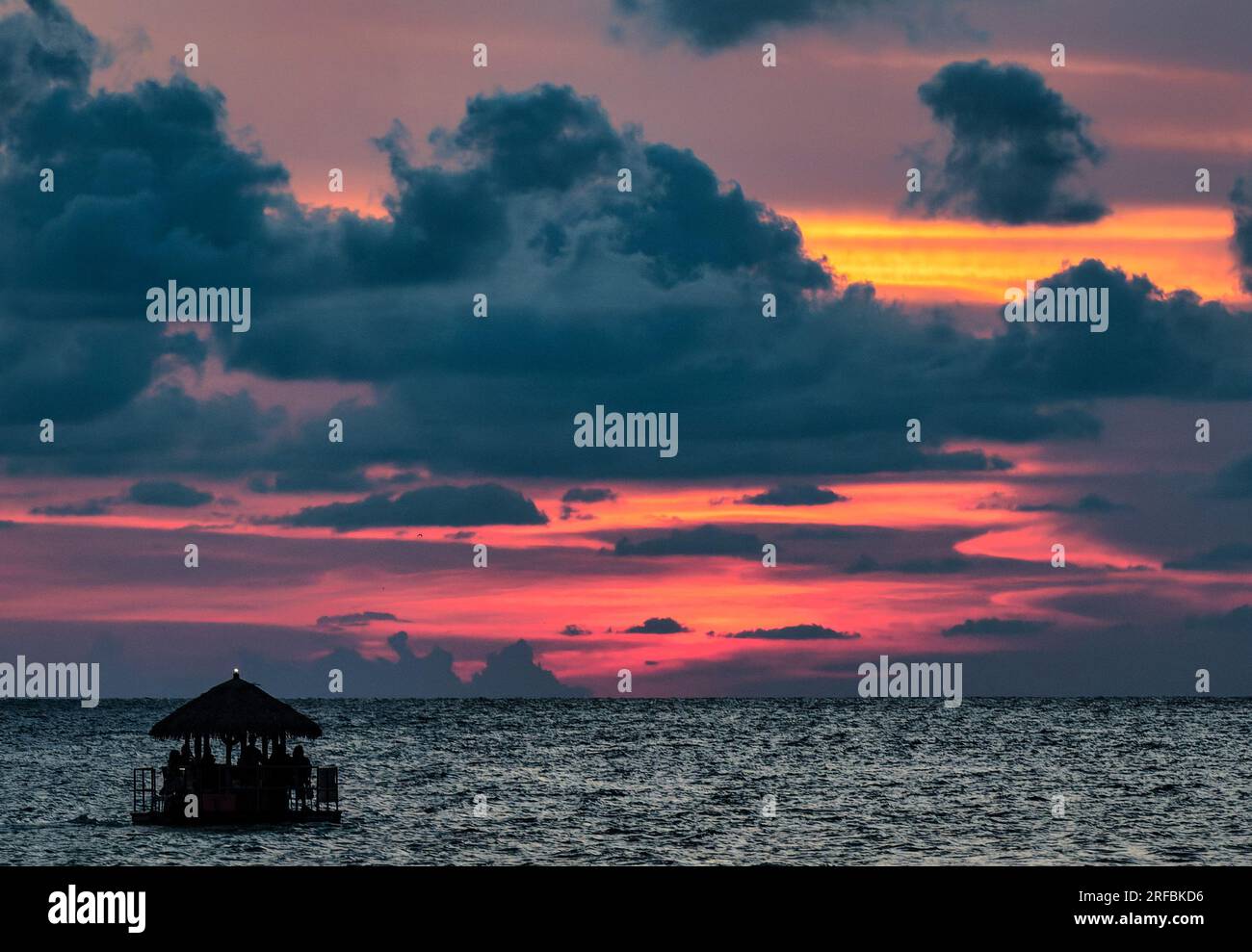 A sunset scene at a beach resort Stock Photo - Alamy