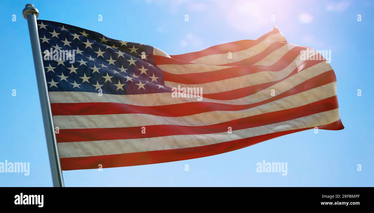 USA United States of America flag waving on blue sky background, sunny ...
