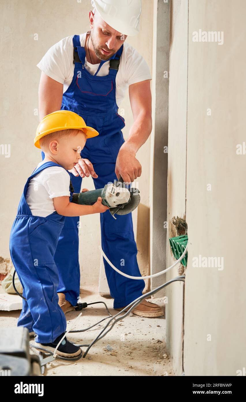 Child holding saw hi-res stock photography and images - Alamy