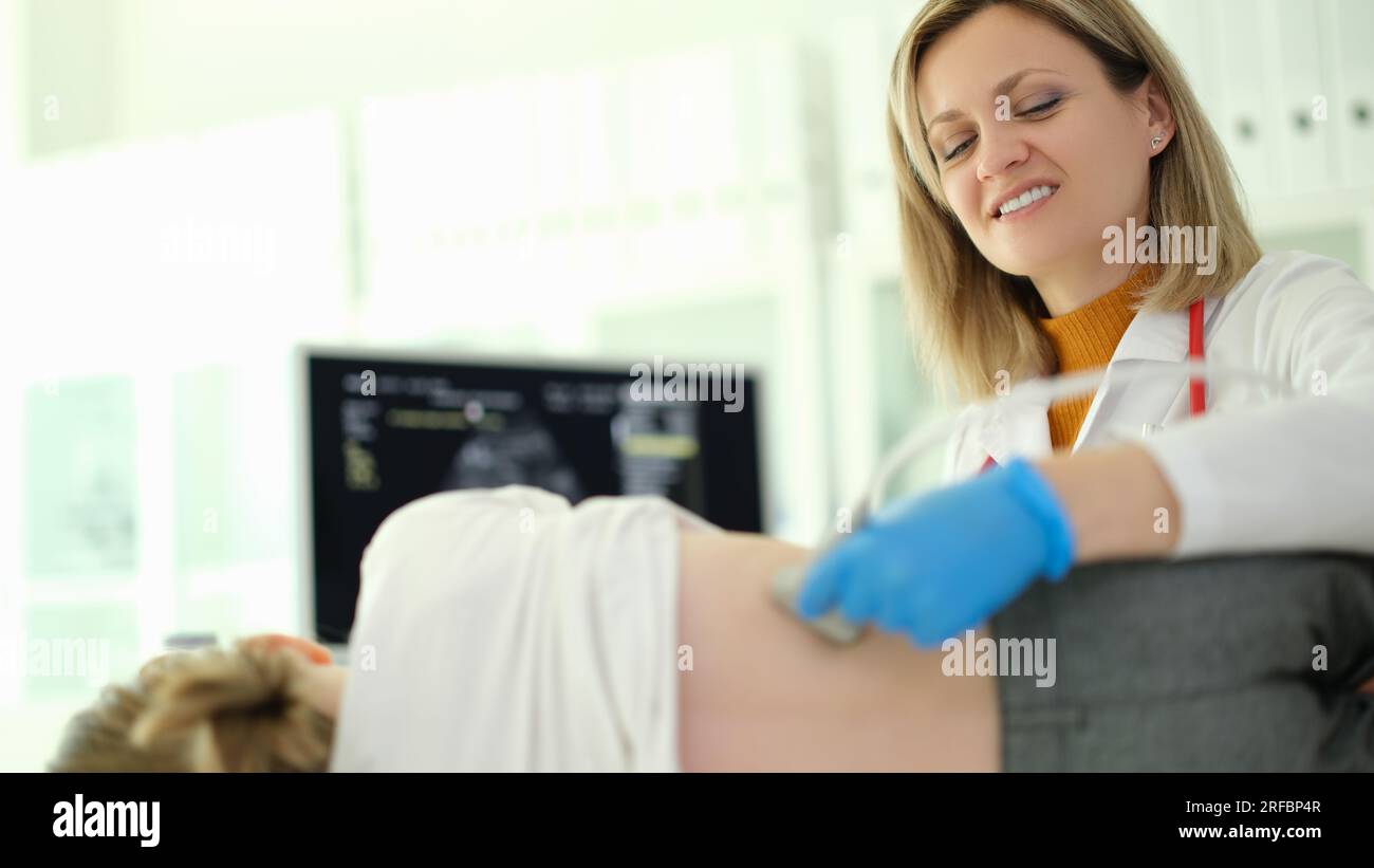 Doctor performing kidney ultrasound scan on school aged girl Stock Photo - Alamy