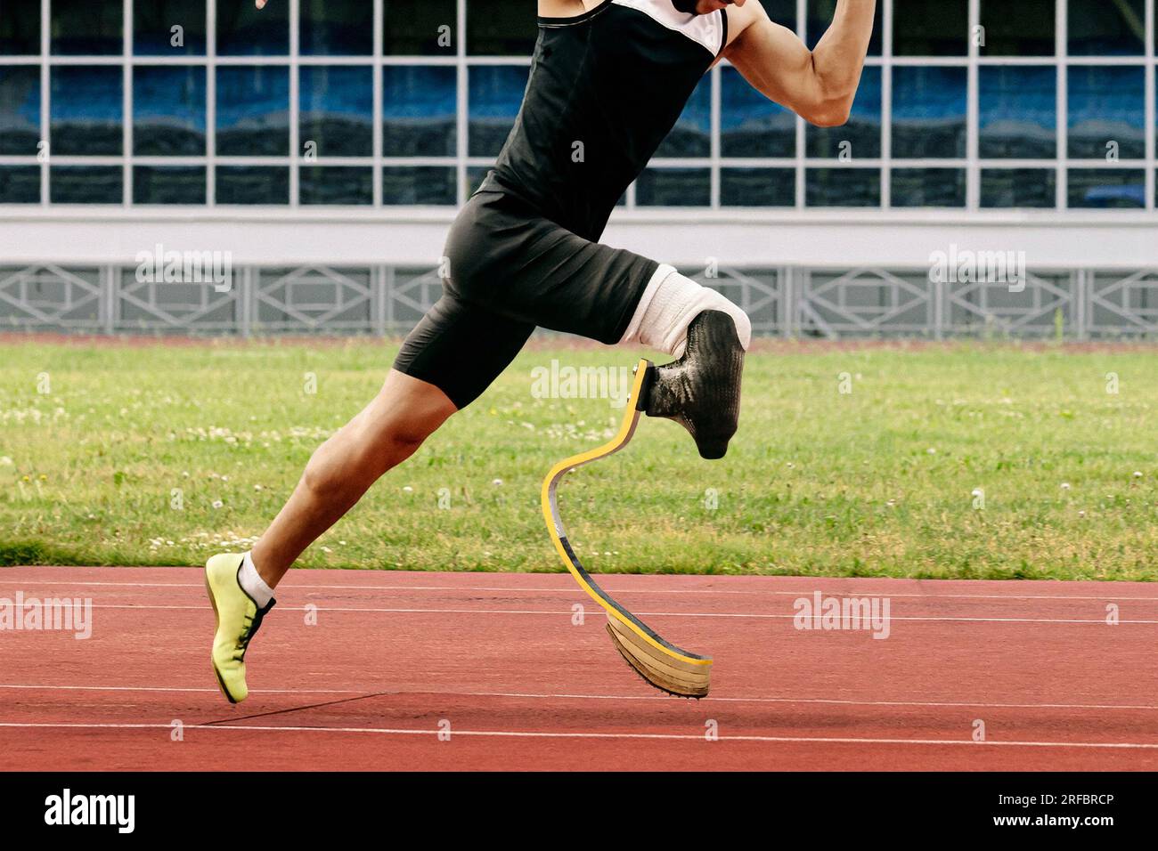 man athlete disability running sprint race at athletics competition ...
