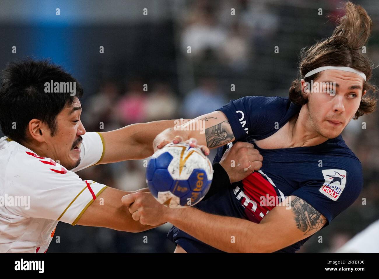 Tokyo, Japan. 2nd Aug, 2023. Japan national team's Kasahara Kenya (L) vies with Paris Saint ...