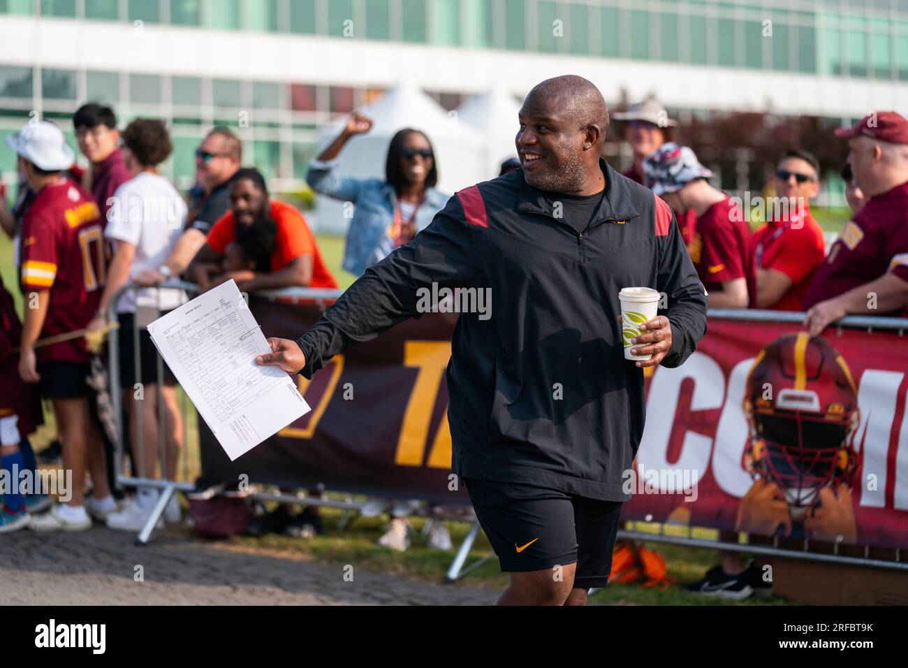 Washington Commanders offensive coordinator Eric Bieniemy greets fans ...