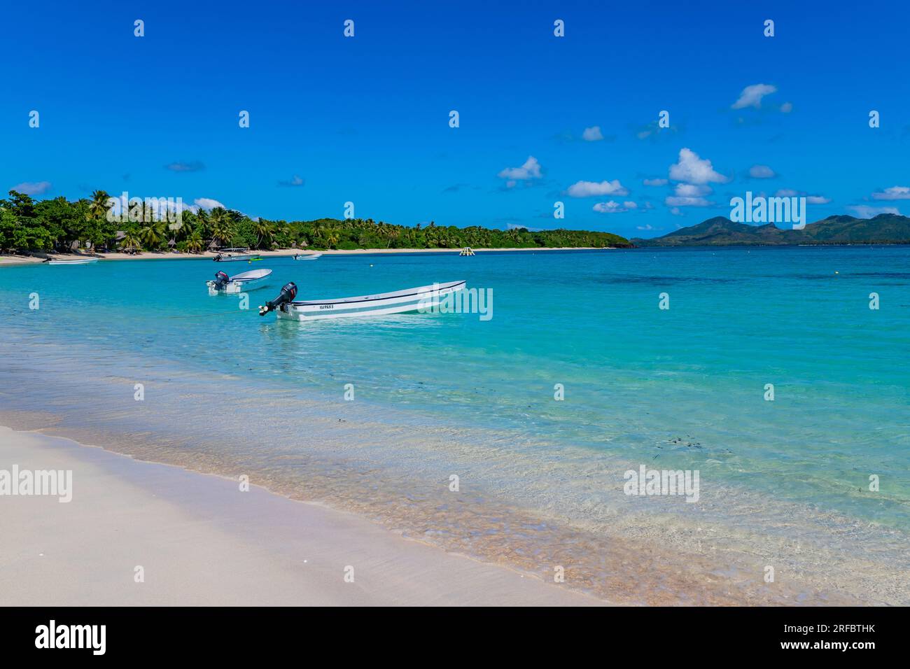 Nacula; Fiji: 25, June, 2023: Boats in the stunning idyllic blue lagoon ...