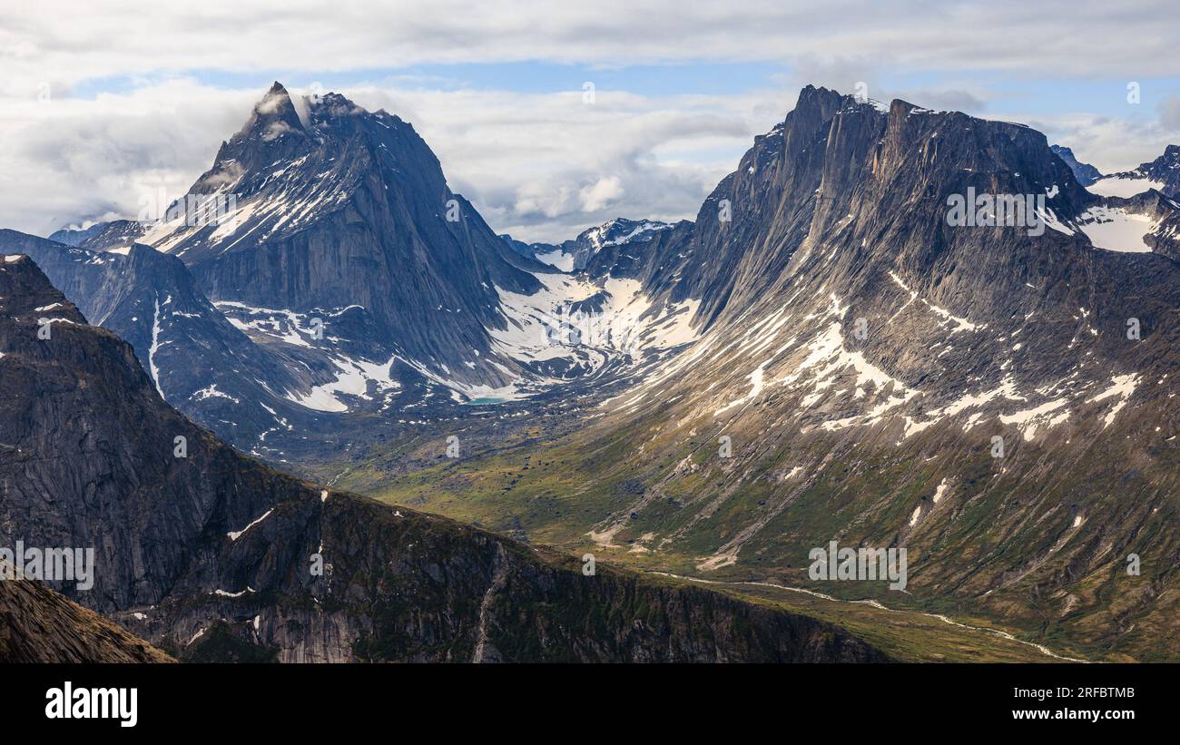 aerial photo of the steep sided rocky mountain peaks of the tasermiut ...