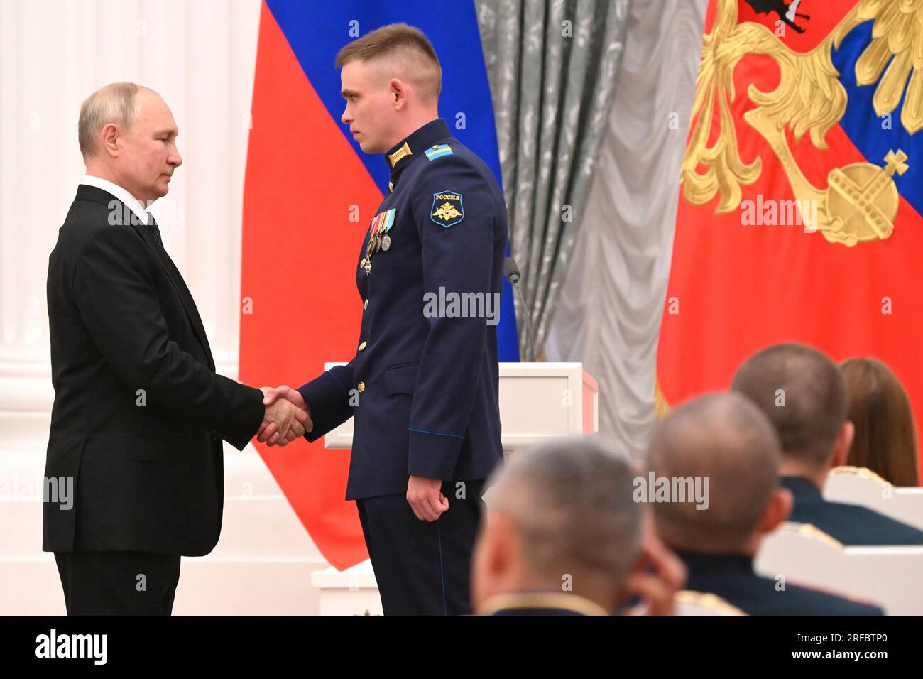 Russian President Vladimir Putin awards Senior Sergeant Sergey Ryabov with the title of Hero of ...