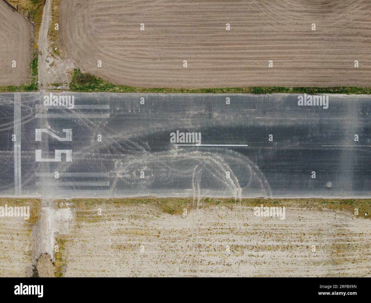 Top down aerial shot of a section of disused runway at Woodford ...