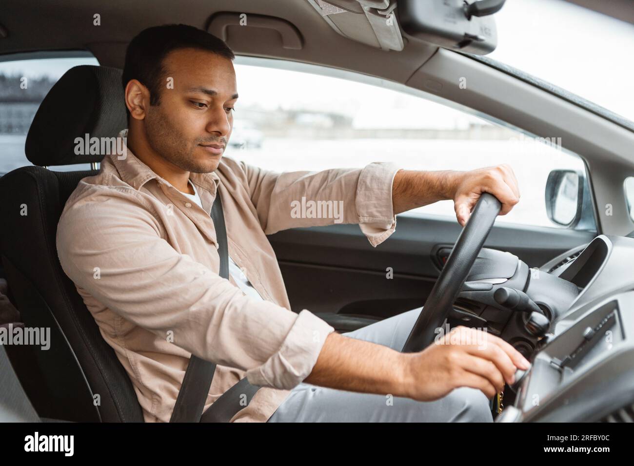 Arab Driver Guy Driving Automobile, Pushing Buttons On Dashboard Pannel ...