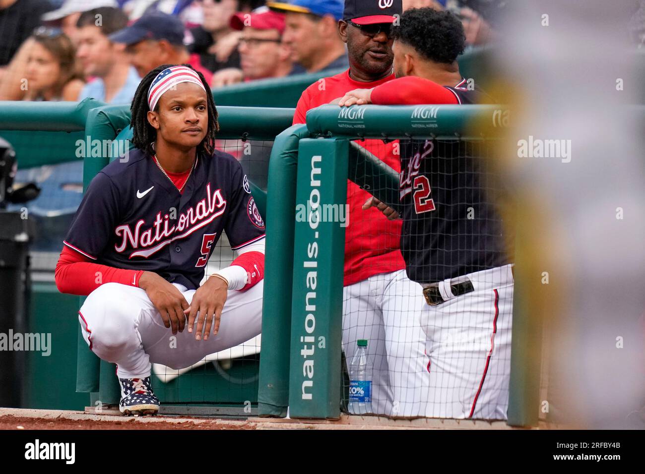 Washington Nationals shortstop CJ Abrams, left, sits on the edge of the ...