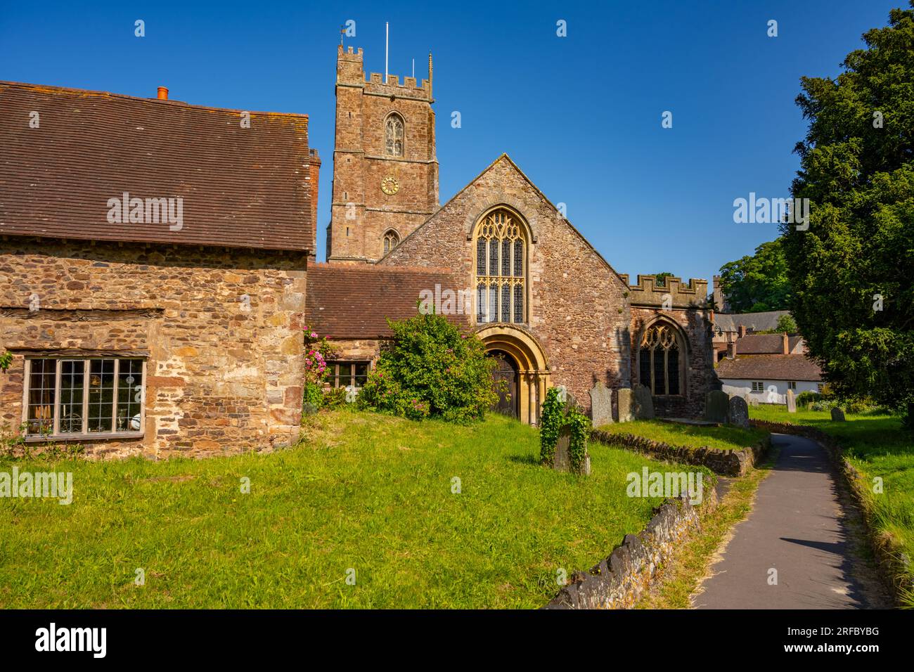 The tower and churchyard of St Georges church Dunster, Somerset Stock ...