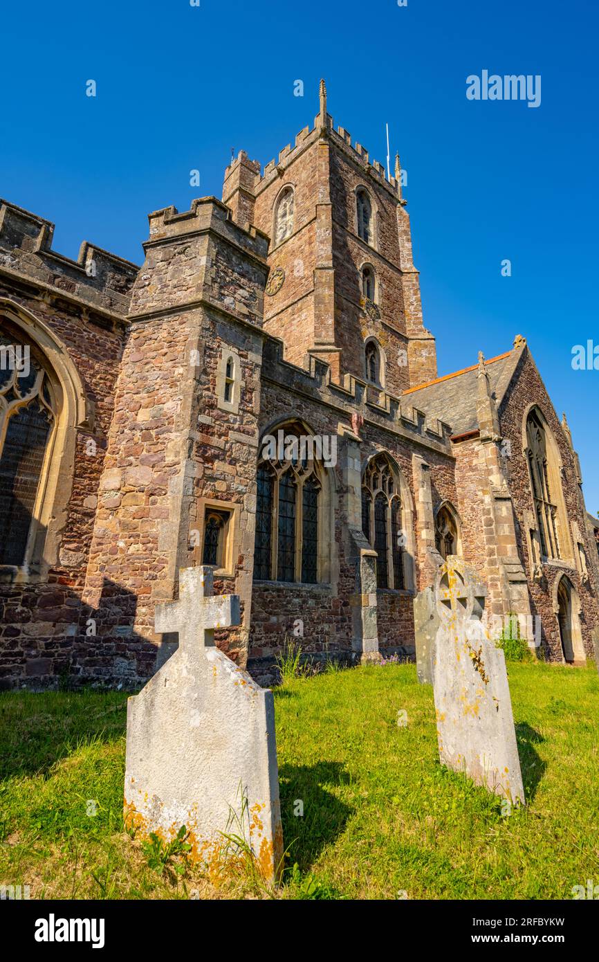 The tower and churchyard of St Georges church Dunster, Somerset Stock ...