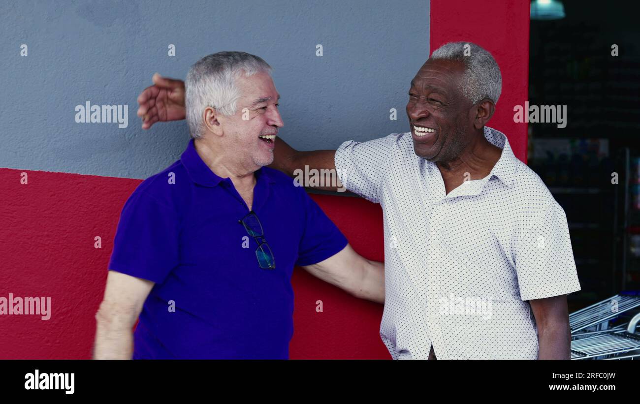 Authentic Interaction of Two Happy Diverse Older Friends, Hugging and ...