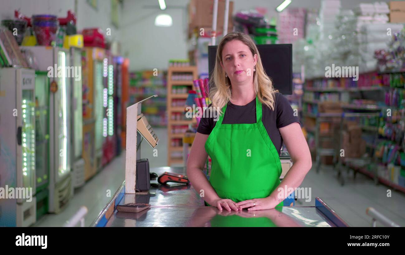 Female grocer wearing apron hi-res stock photography and images - Alamy