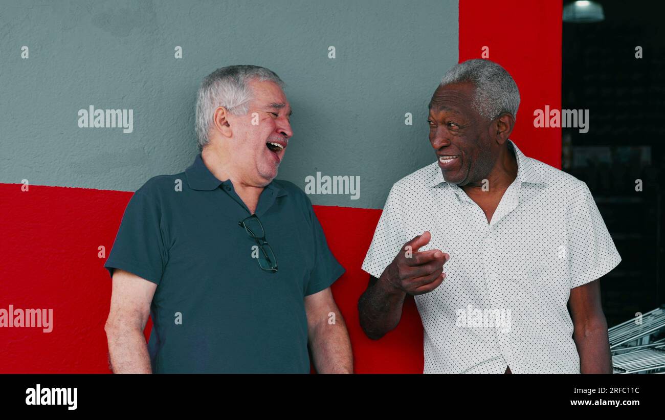 Joyful Interaction of Two Diverse Male Senior Friends, Smiling and ...
