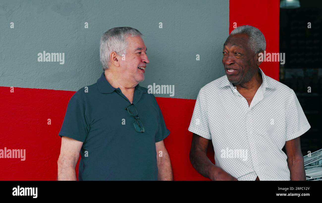 Joyful Interaction of Two Diverse Male Senior Friends, Smiling and ...
