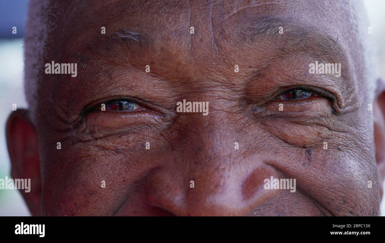 Macro close-up of a charismatic happy senior elderly person eyes ...