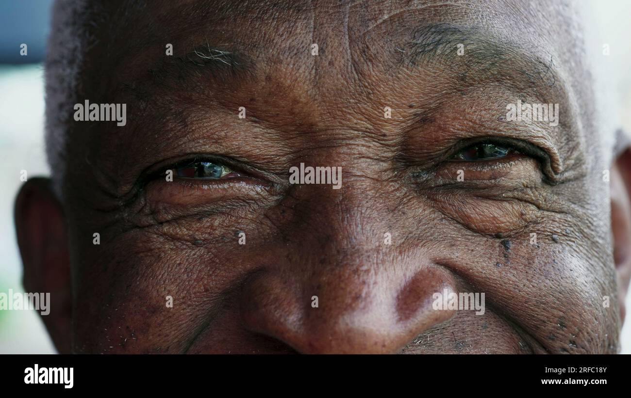 One black senior man closing eyes in contemplation, macro close-up of an African American ...