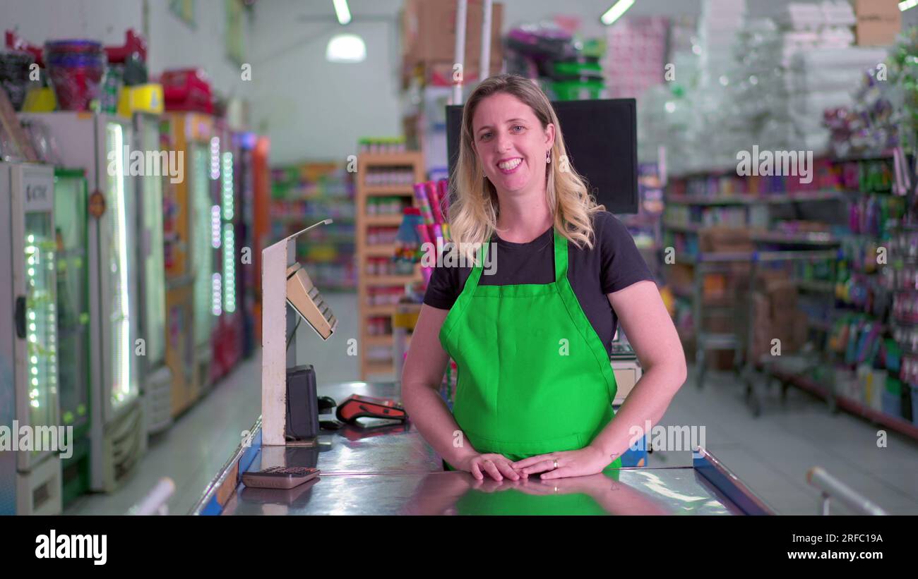 Female employee supermarket standing cashier hi-res stock photography ...