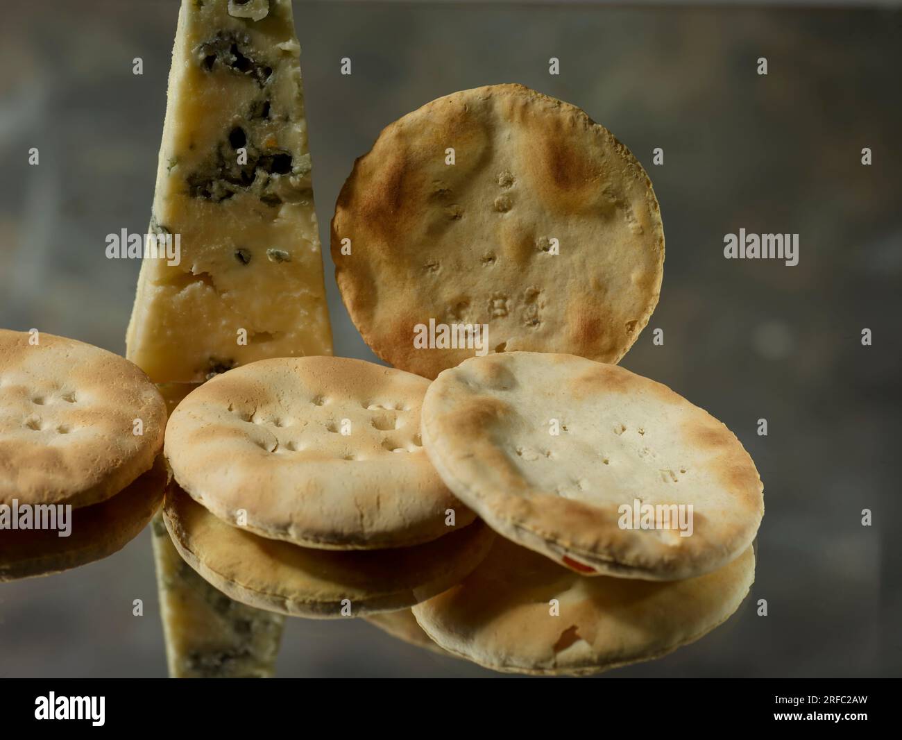 Classic close up food still life of Water Biscuits and Stilton cheese ...