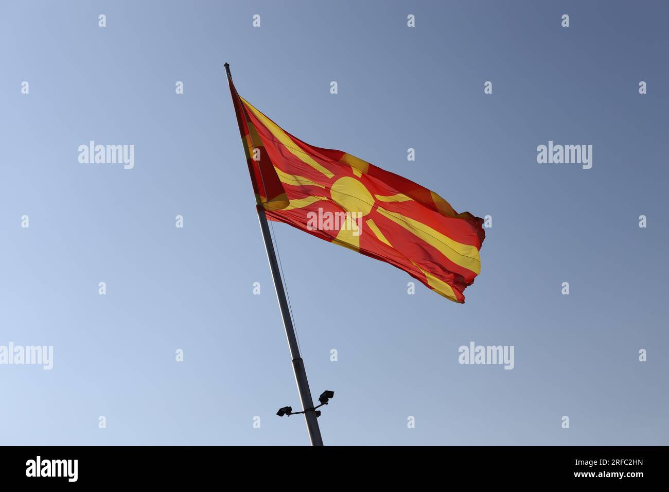 The flag of North Macedonia on sky Stock Photo - Alamy