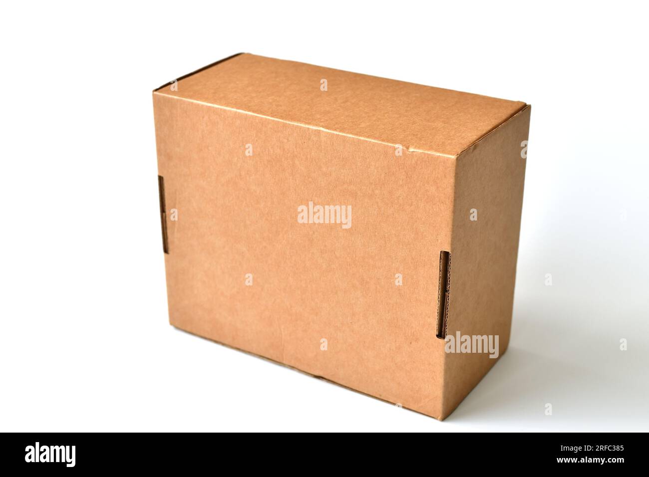 Closed cardboard box isolated on a white background Stock Photo - Alamy