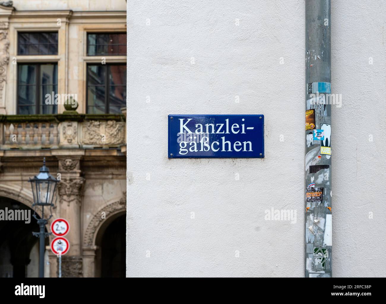 white wall with blue street sign "Kanzleigäßchen (chancellery alley ...