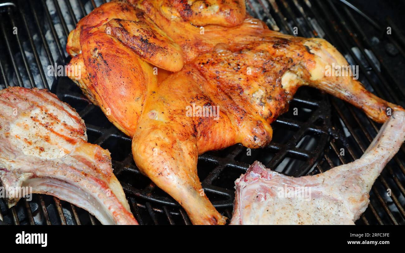 very big grilled chicken and bbq pork chop Stock Photo - Alamy