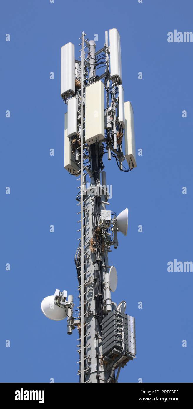high cell tower with many antennas and repeater of mobile ...