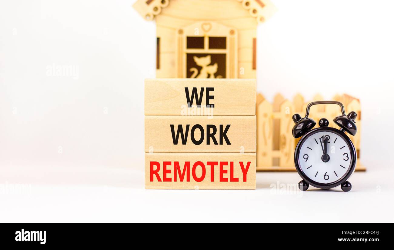 We work remotely symbol. Concept words We work remotely on wooden block ...