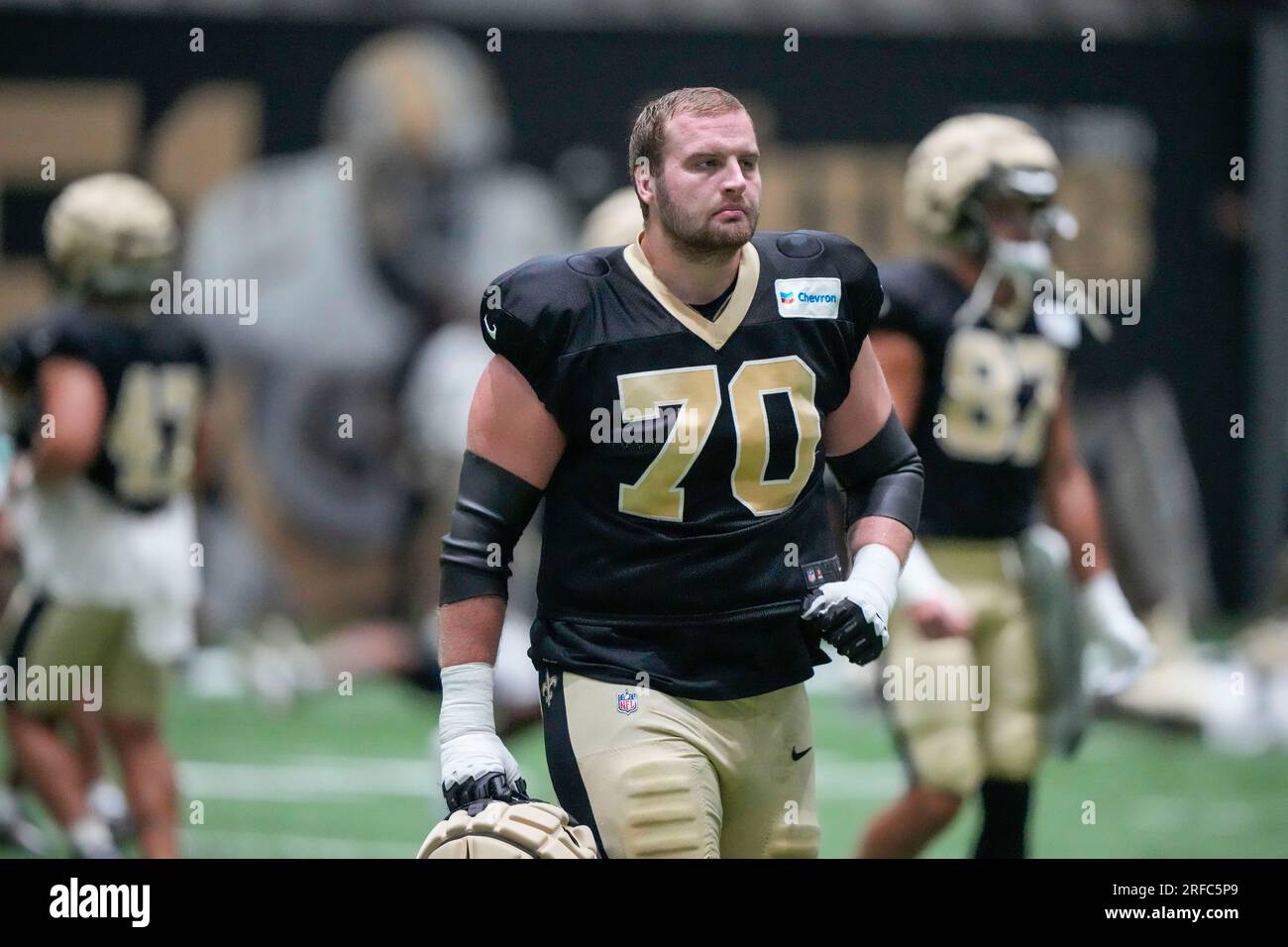 New Orleans Saints offensive tackle Trevor Penning (70) warms up at the ...