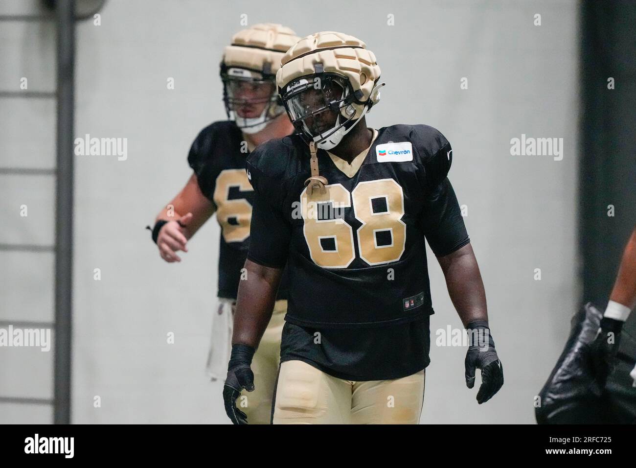 New Orleans Saints offensive lineman Mark Evans II (68) runs through ...