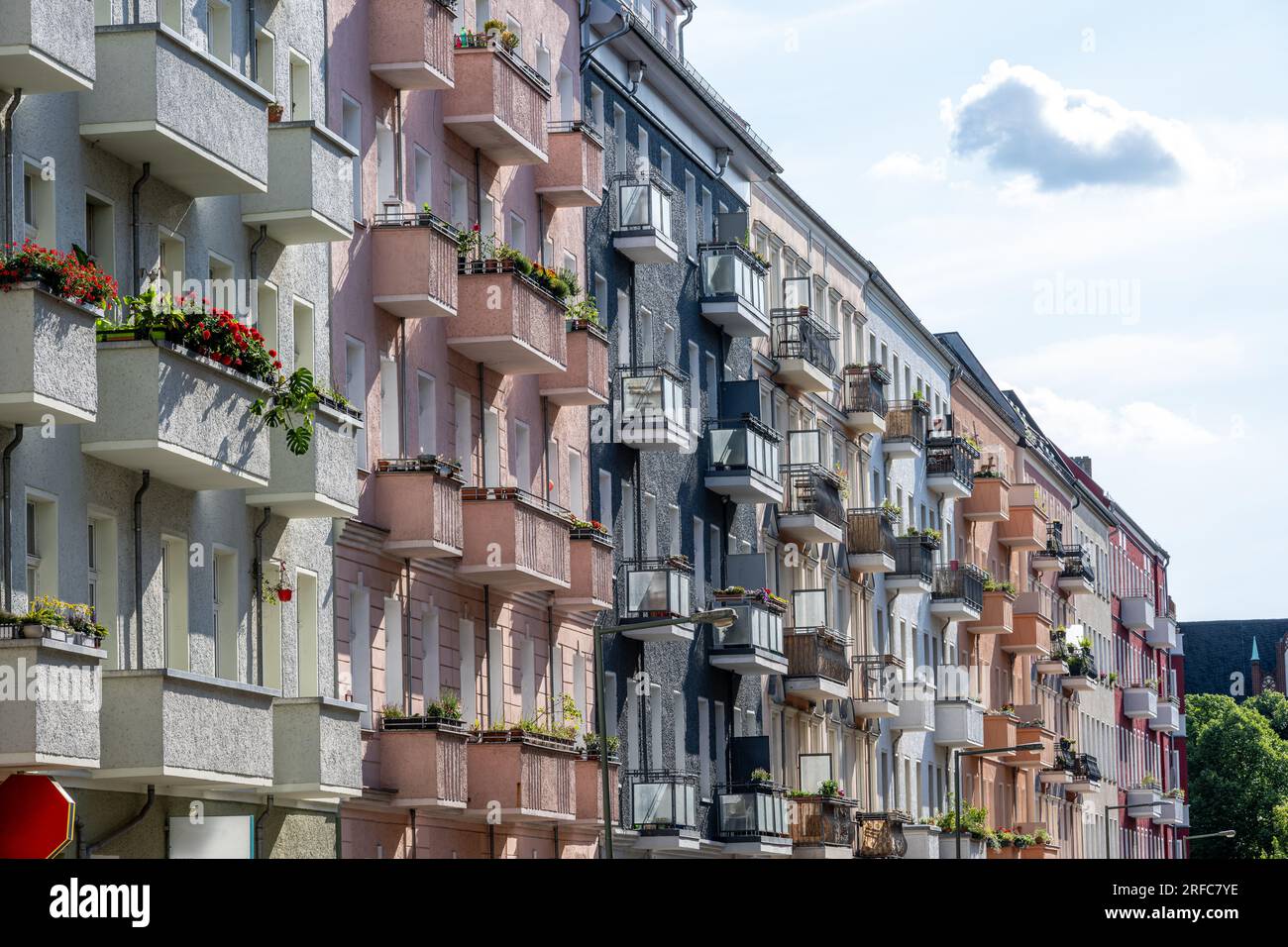 Street with multi-colored old apartment buildings seen in Berlin ...