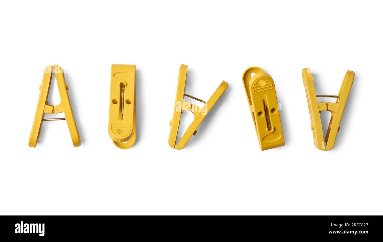 set of yellow clips, plastic paper or laundry clips, clothespin or ...