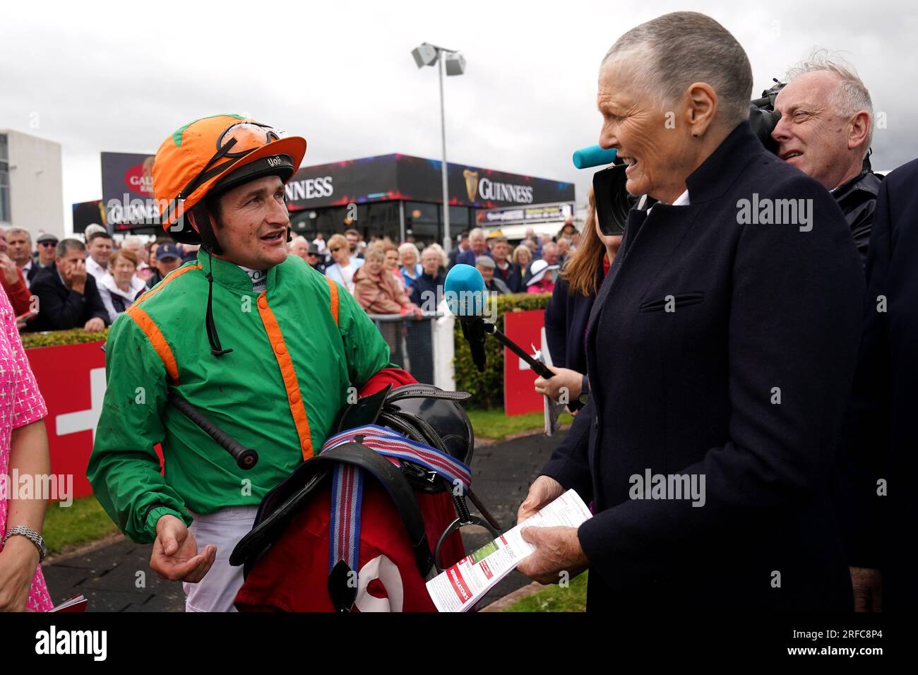 Jockey Shane Foley speaks with trainer Jessica Harrington after winning ...