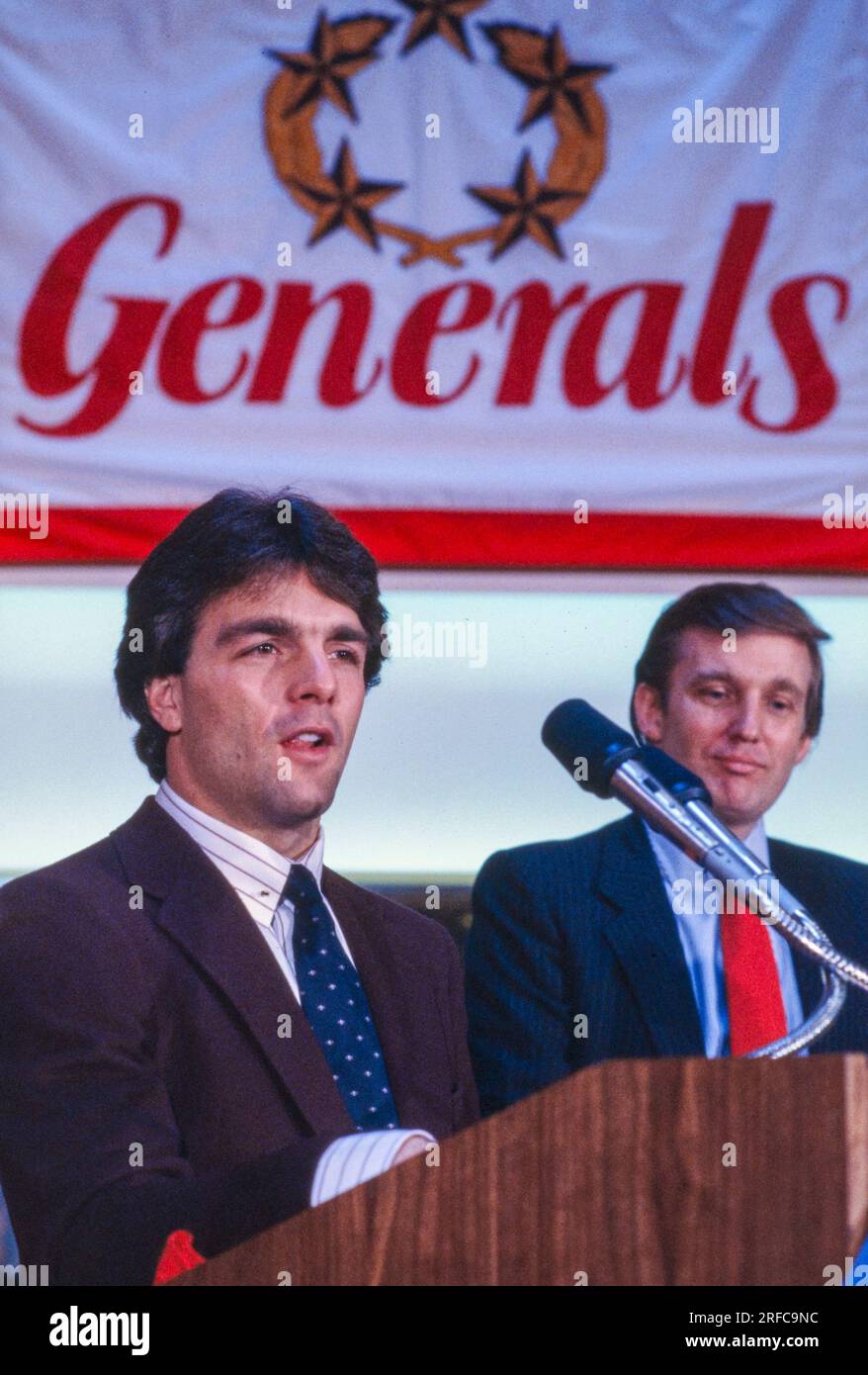 Doug Flutie speaks as Donald Trump looks on. Donald Trump acquires the ...