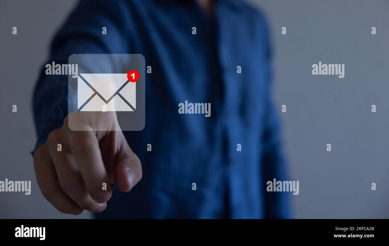 Businessman pressing messaging type of modern icons with virtual ...