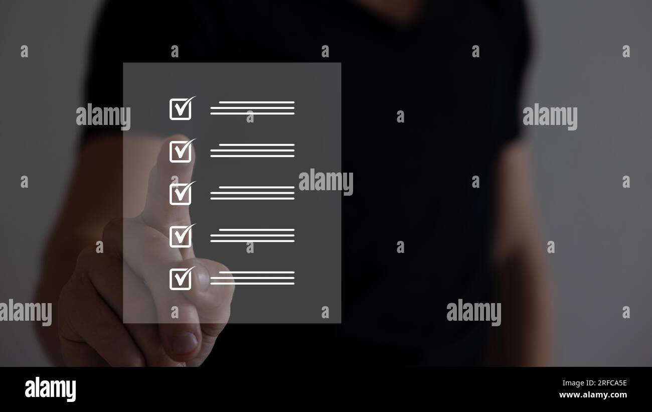 Person working on laptop and management with document check list at ...