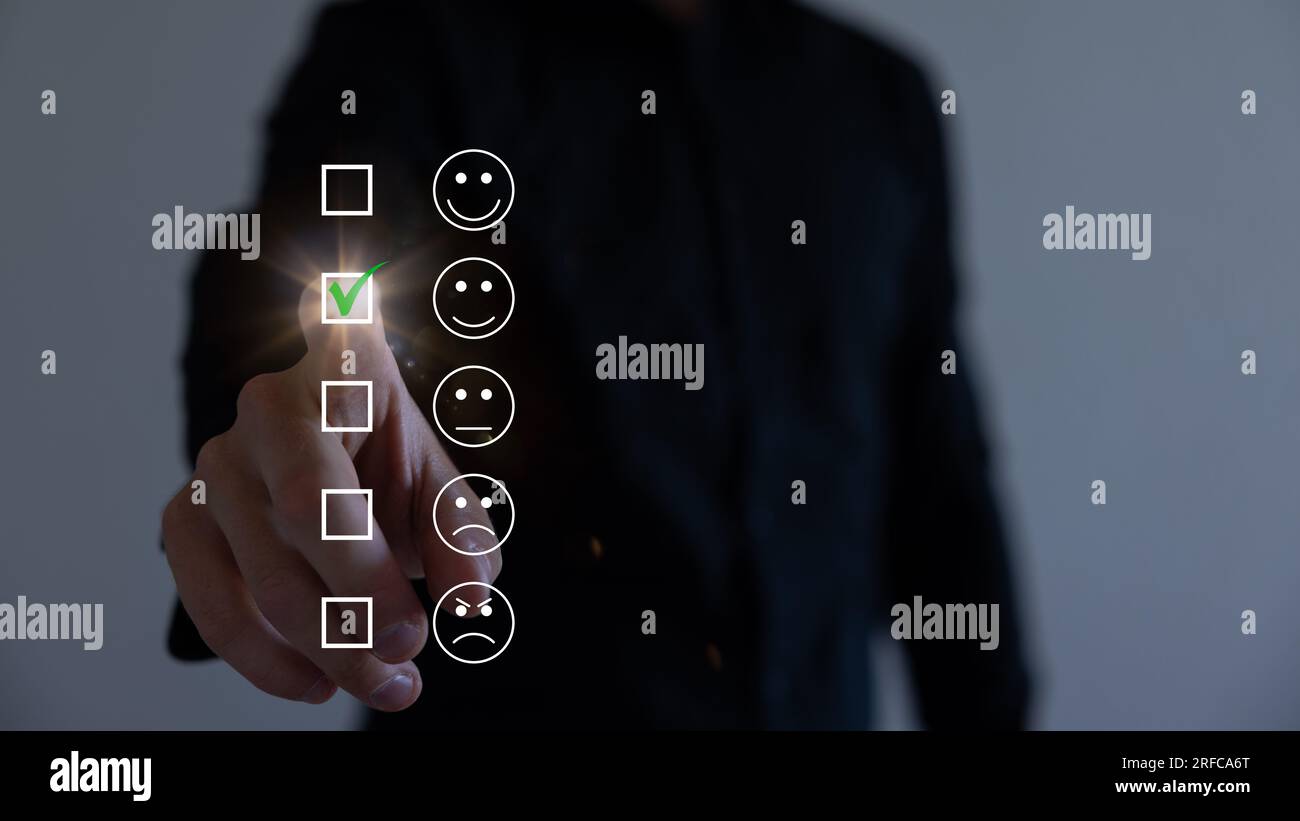 Businessman pressing smiley face emoticon on virtual touch screen ...