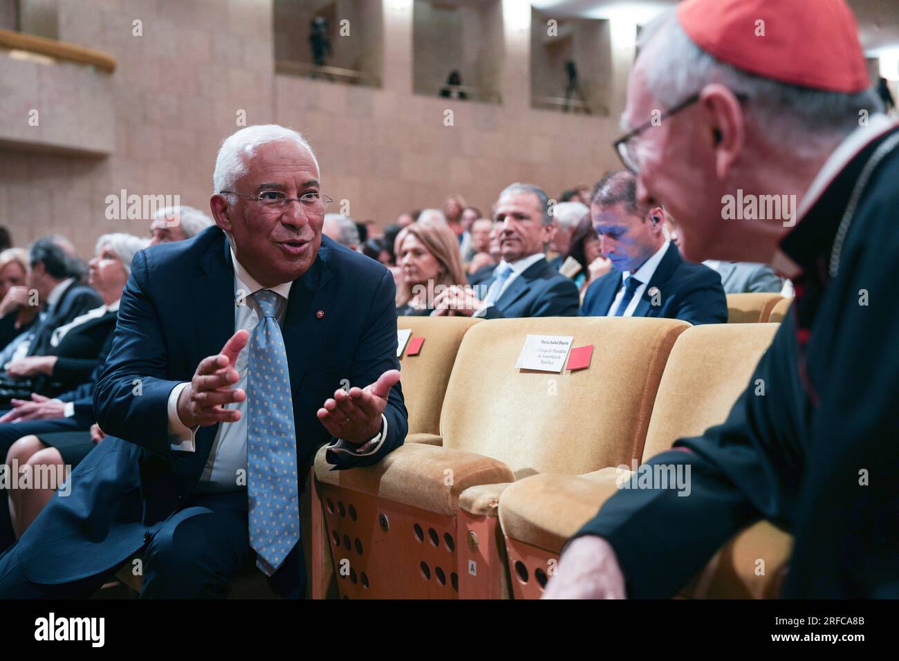 Portugal's Prime Minister Antonio Costa, left, speaks with Cardinal ...