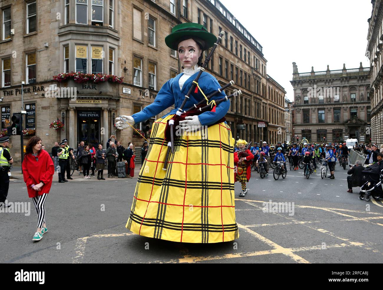 A giant piper leads the procession during the opening ceremony for the ...