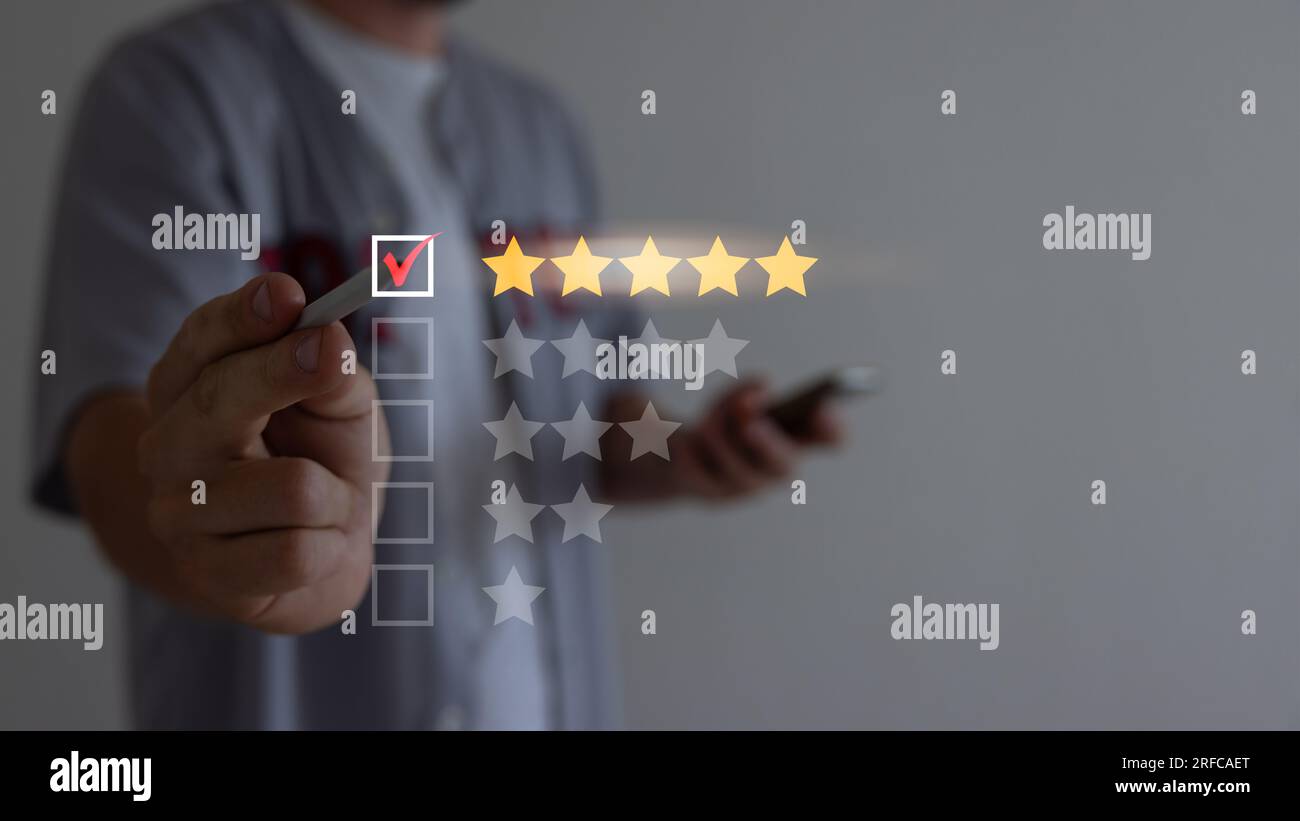 Close up of man customer giving a five star rating on smartphone. Using ... Close up of man customer giving a five star rating on smartphone. Using ...